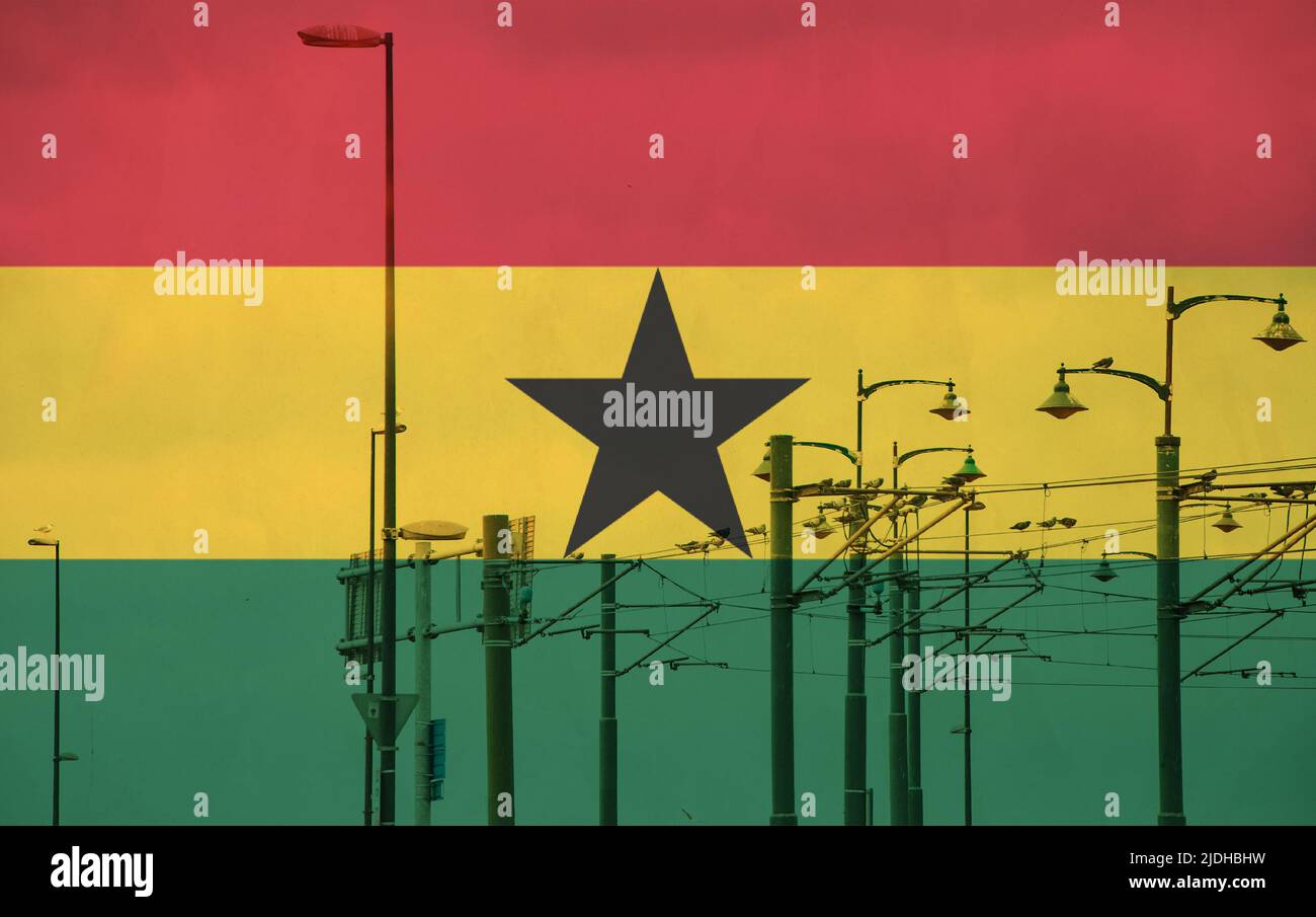 Ghana flag with tram connecting on electric line with blue sky as ...