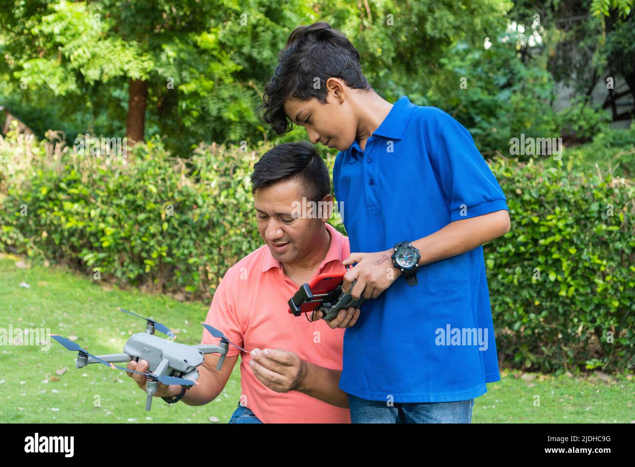 Family flying drone hi-res stock photography and images - Alamy