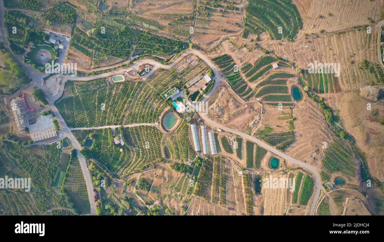 Green mountainous fields and roads in semi-desert, Mount Lebanon ...