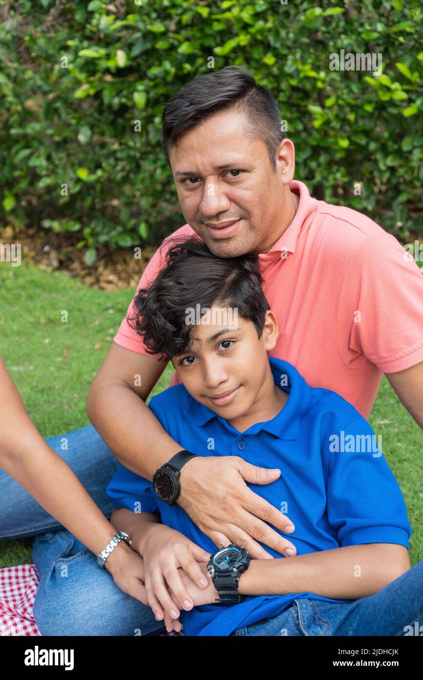 Portrait of a father with his teenage son in the open air Stock Photo ...