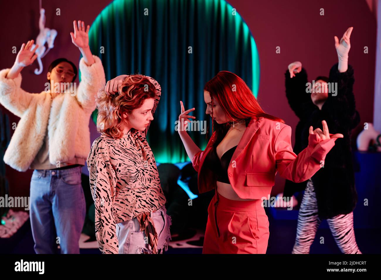 Side view portrait of two girls in dance battle challenge at nightclub ...