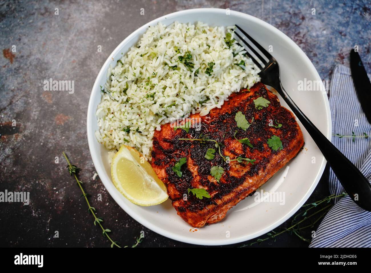 Homemade Blackened salmon served with cilantro lime rice Stock Photo ...