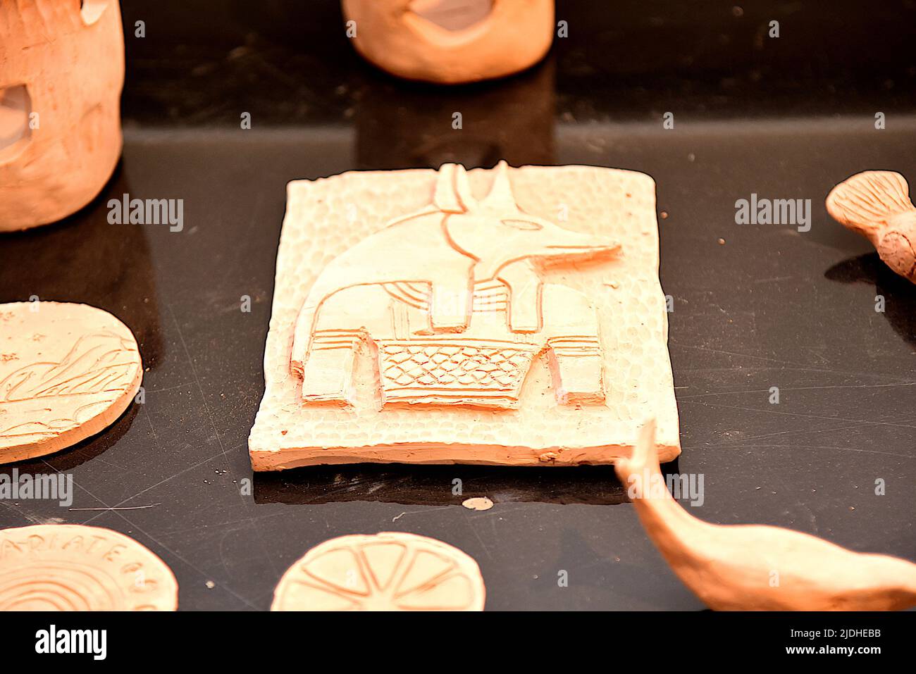 Pottery craft class in Karachi school; clay wolf model after baking ...