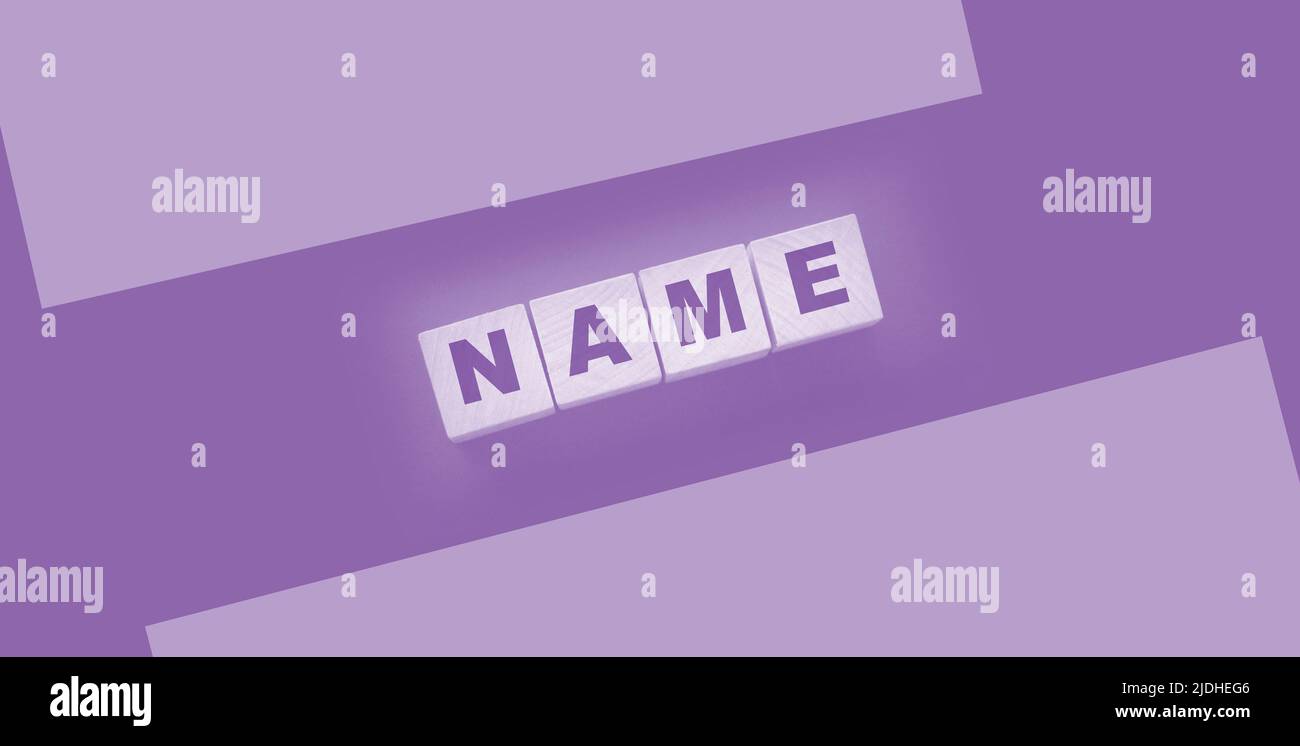 Name word with wooden block on black blackboard. Business or personal ...