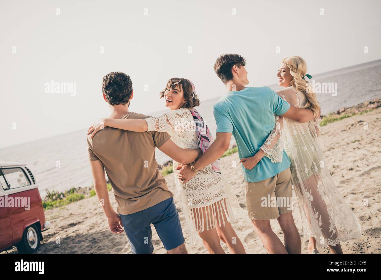 Photo of four people gathering carefree tourism 70s boho adventure wear ...