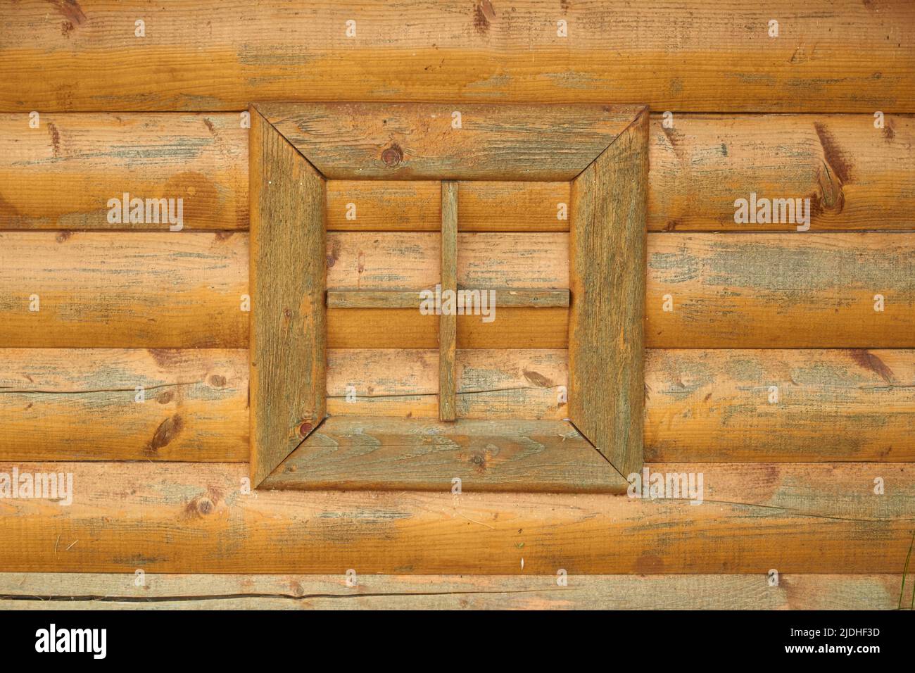 Fake window frame on the background of wooden logs Stock Photo - Alamy