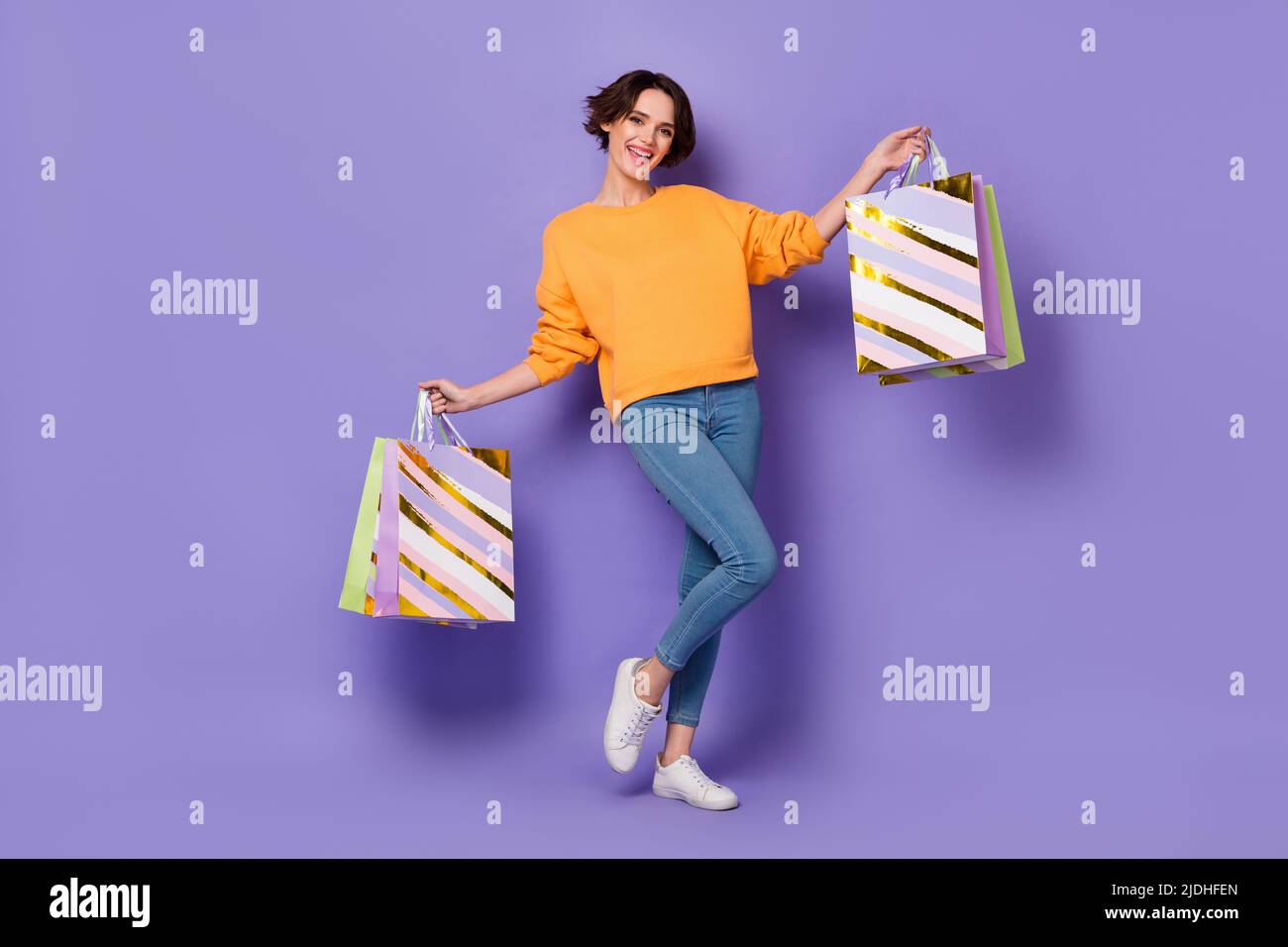 Full length body size view of attractive cheerful girl dancing buying ...