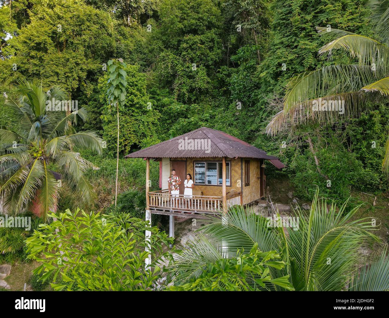 Railay Beach Krabi Thailand, a tropical beach of with backpacker bamboo huts in the jungle ...
