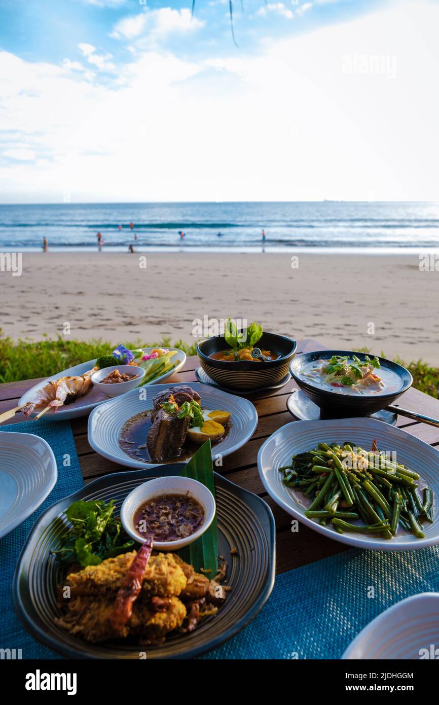 Thai food on a table on the beach in Thailand. table with Thai food ...