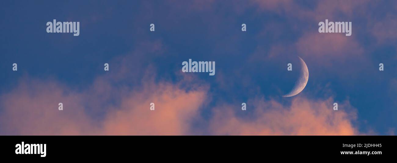 Sunset sky with large crescent moon, evening sky background Stock Photo ...