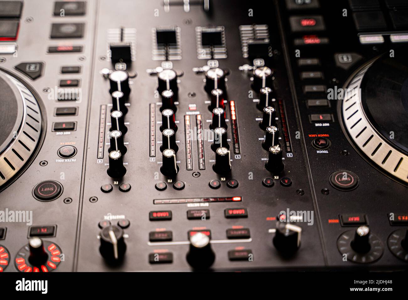 DJ console at night party to mix music Stock Photo - Alamy