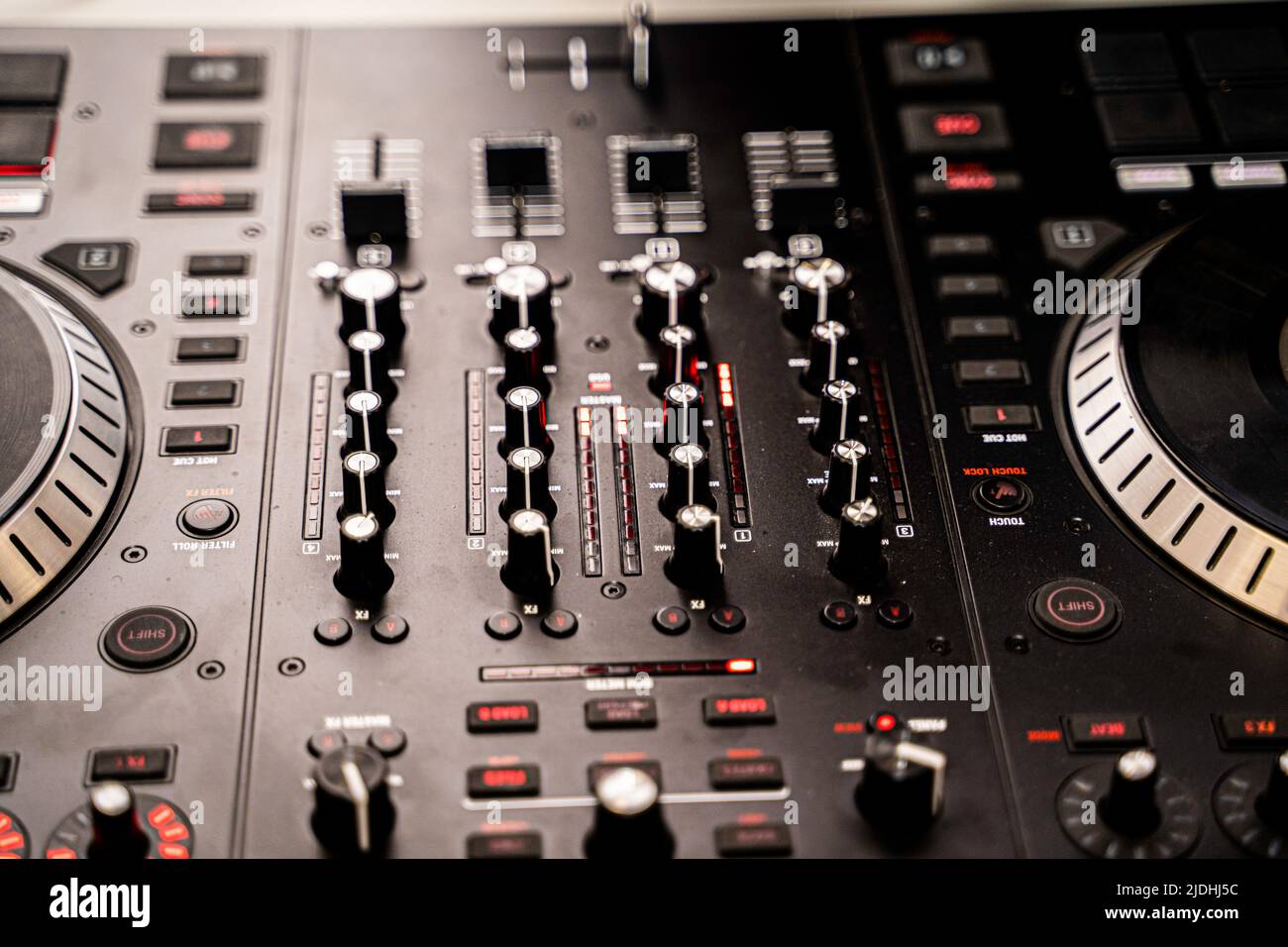 DJ console at night party to mix music Stock Photo - Alamy