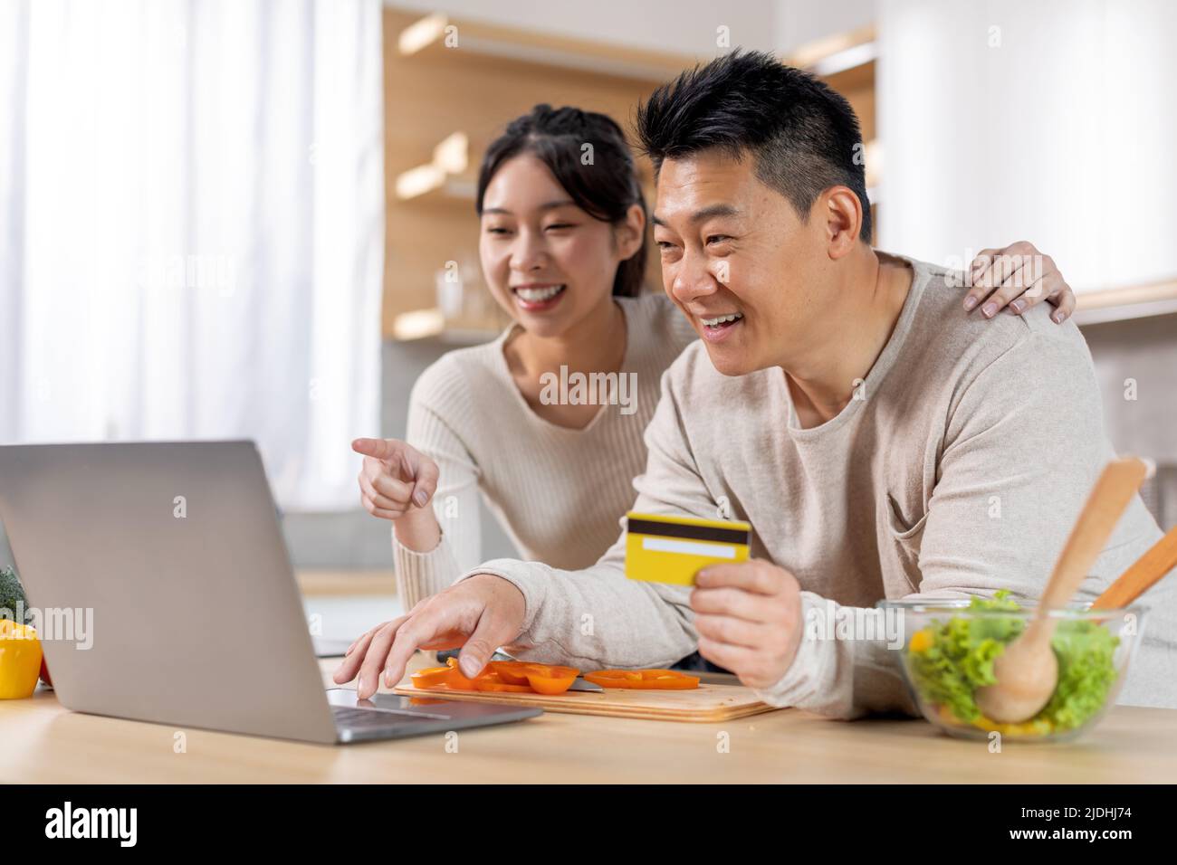 Excited asian couple making hi-res stock photography and images - Alamy