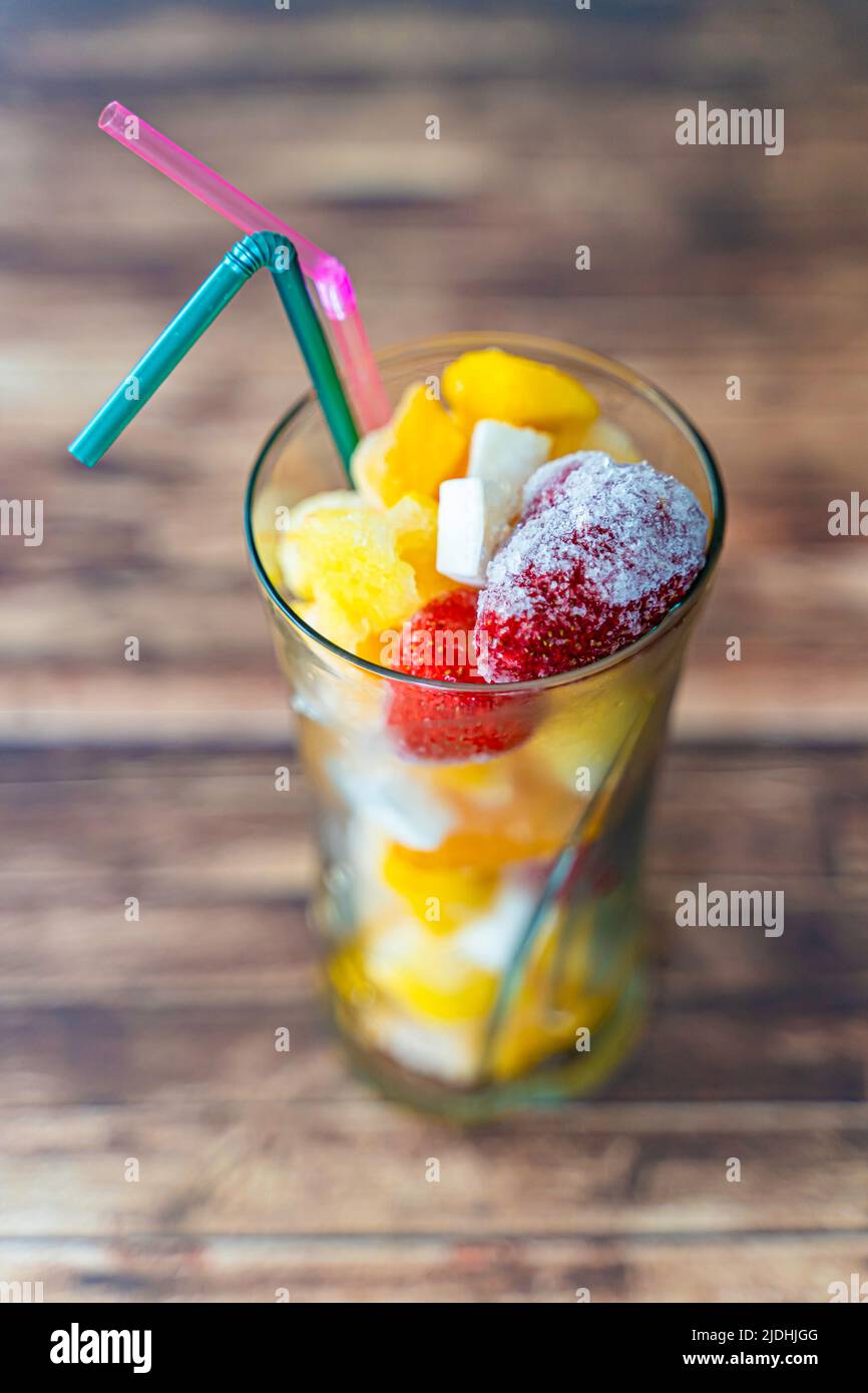 Glass of Frozen Tropical Fruits to prepare a healthy Smoothie Stock ...