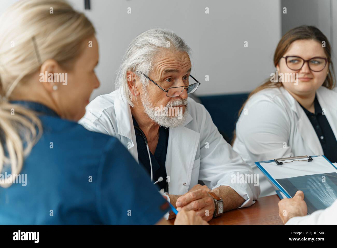 Successful medical doctors are discussing diagnosis during the ...