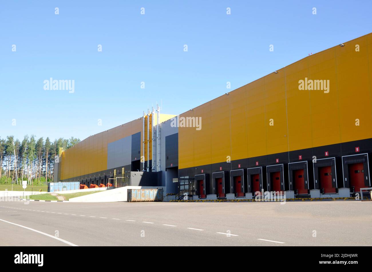 Large distribution warehouse with gates for loading goods. Storage ...