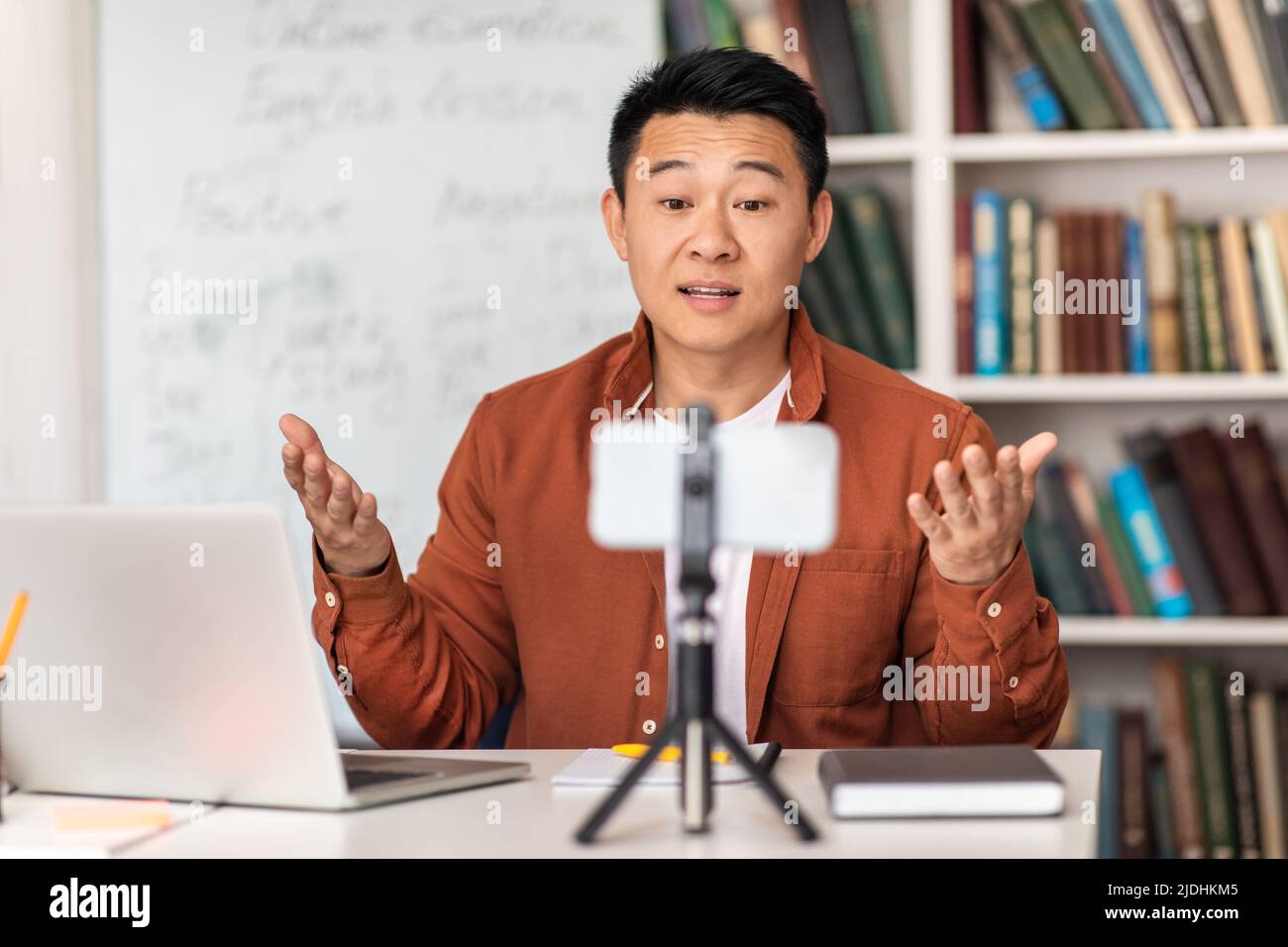 Korean Male Tutor Making Video Call Teaching Online In Classroom Stock ...