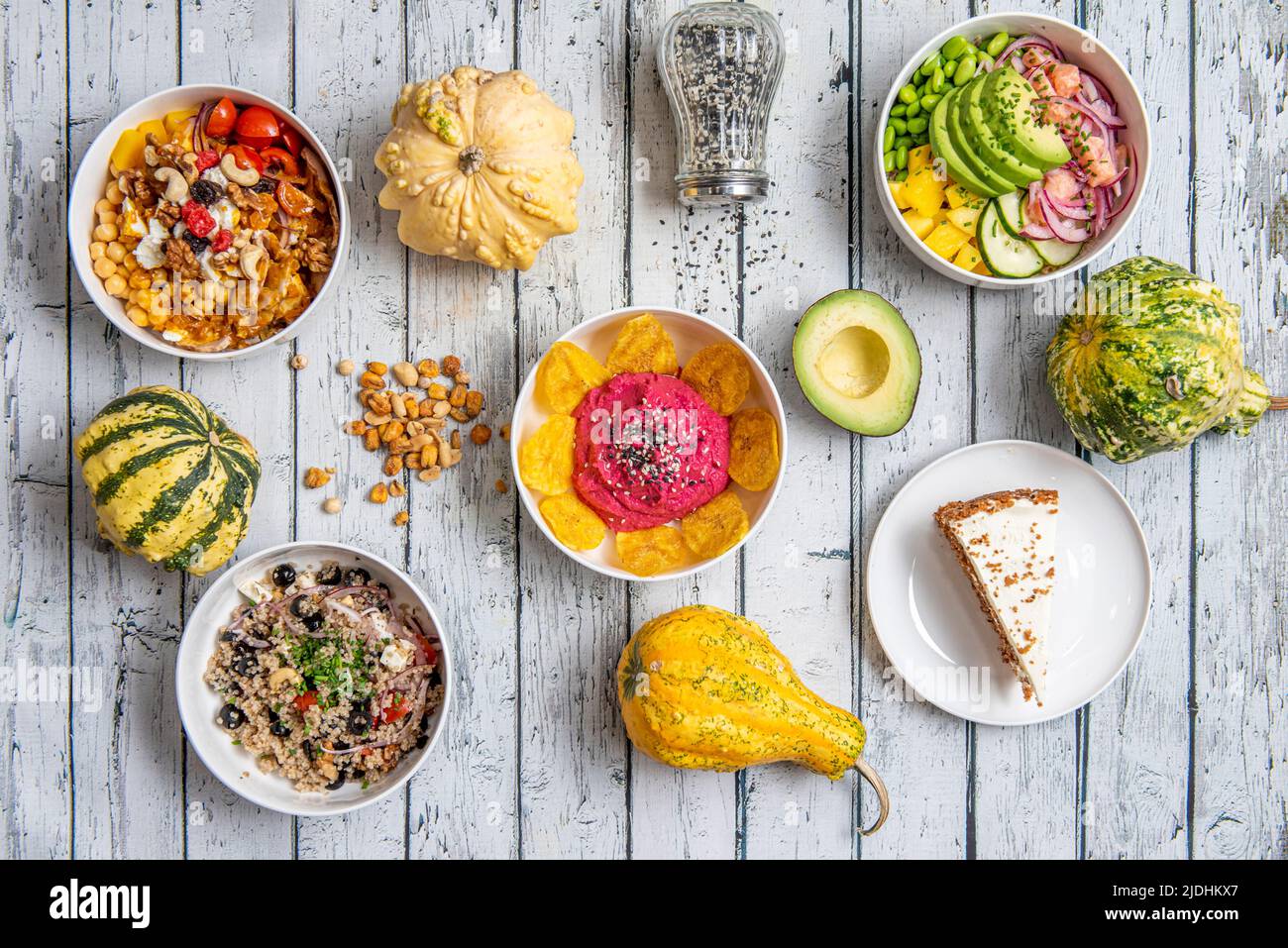 Set of healthy food dishes with avocado, red onion, cooked quinoa ...