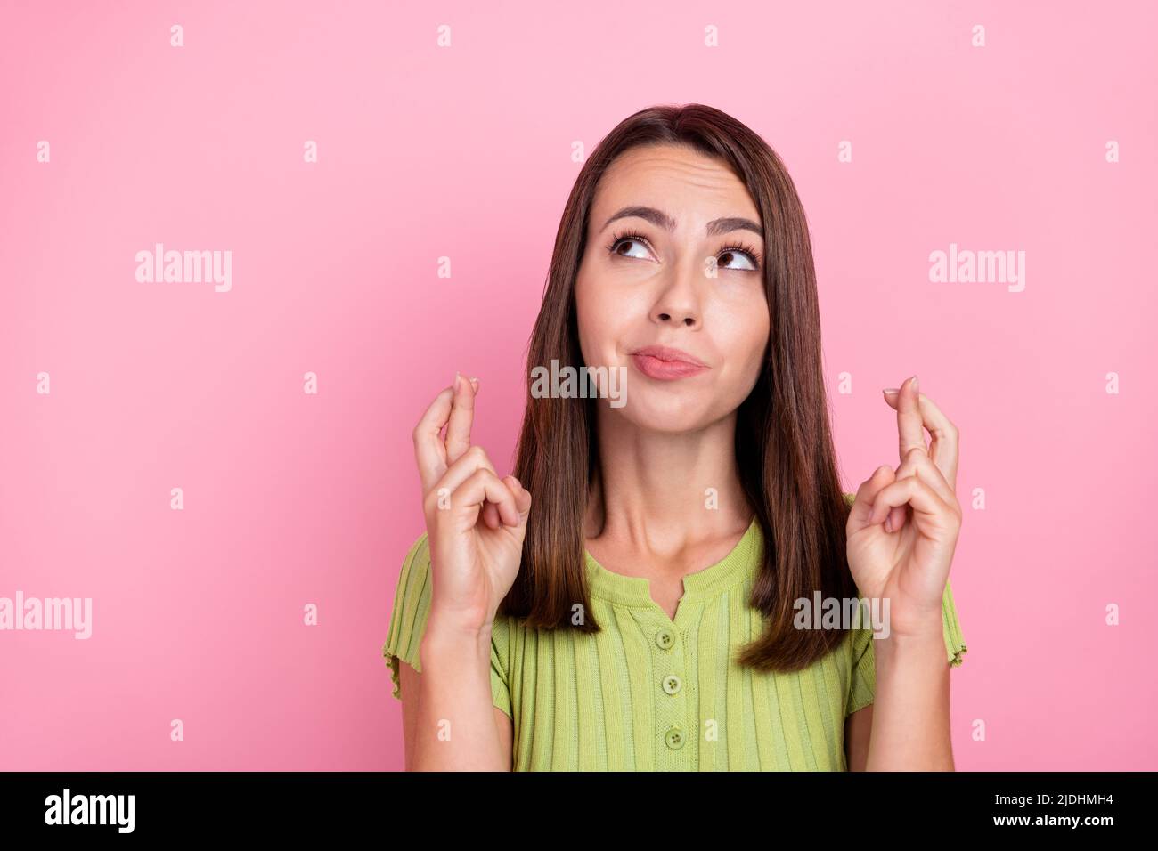 Photo of worry brunette young lady crossed fingers wear green top ...