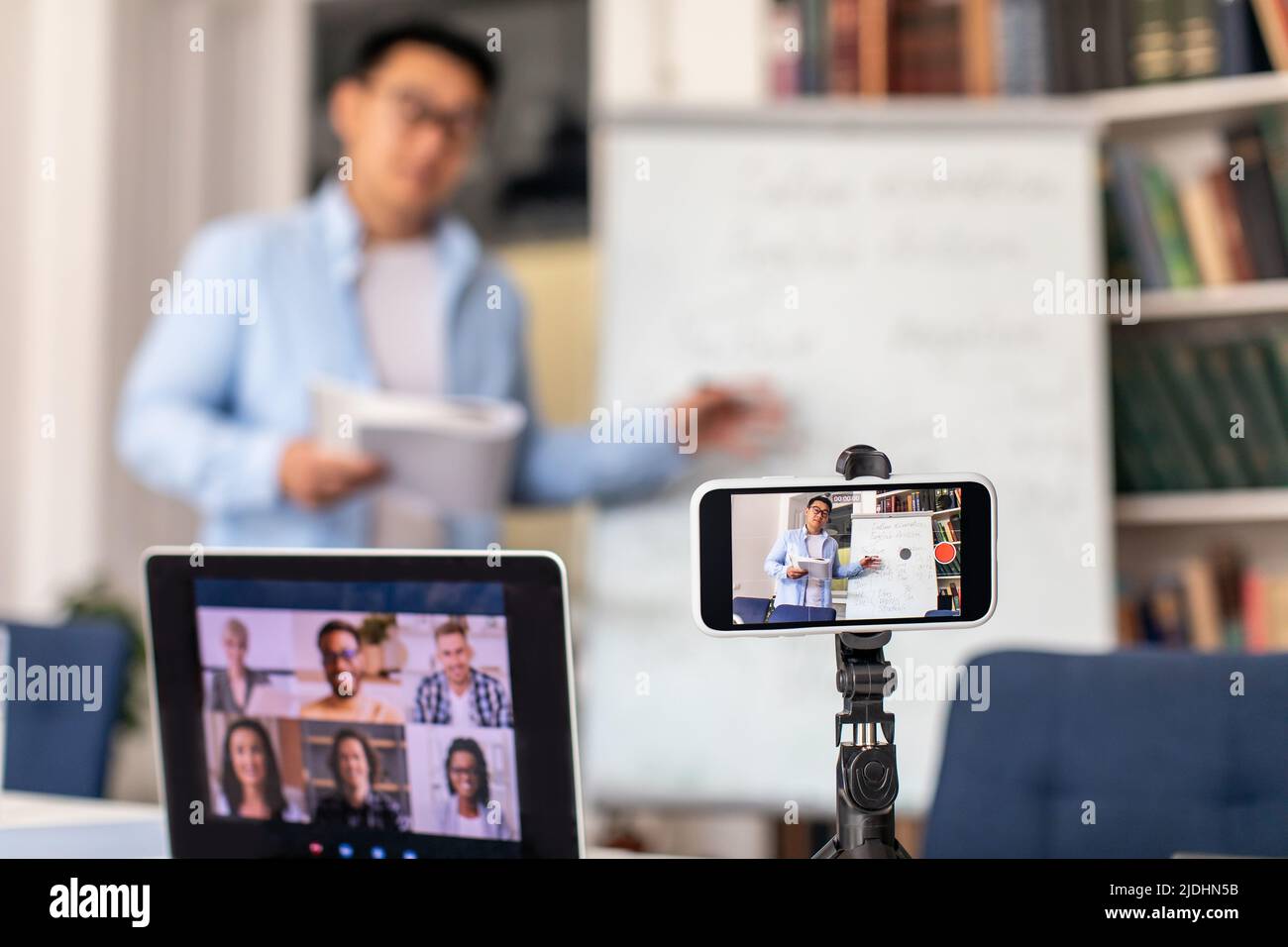 Asian Teacher Making Group Video Call With Distance Students Indoor ...