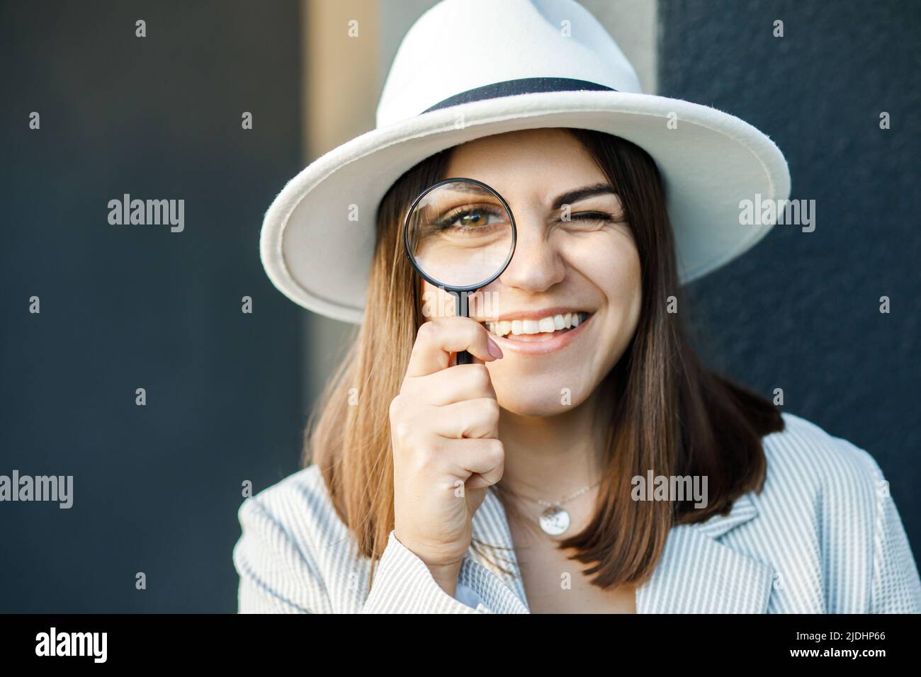 Closeup looking into magnifying glass hi-res stock photography and images - Alamy