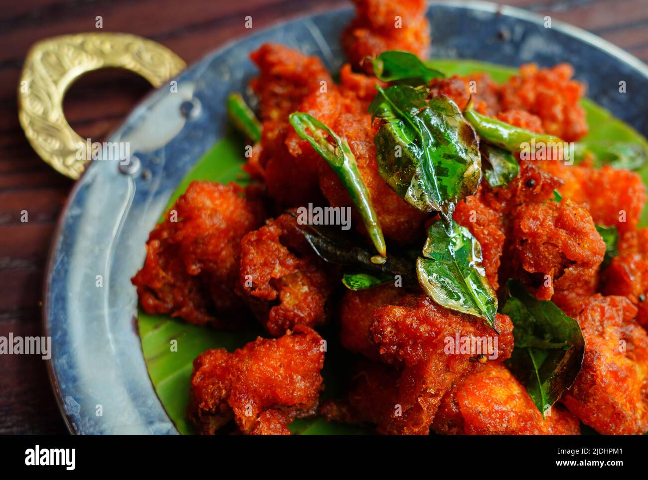 Dish of Fried cauliflower florets bites with Indian spices and mustard ...