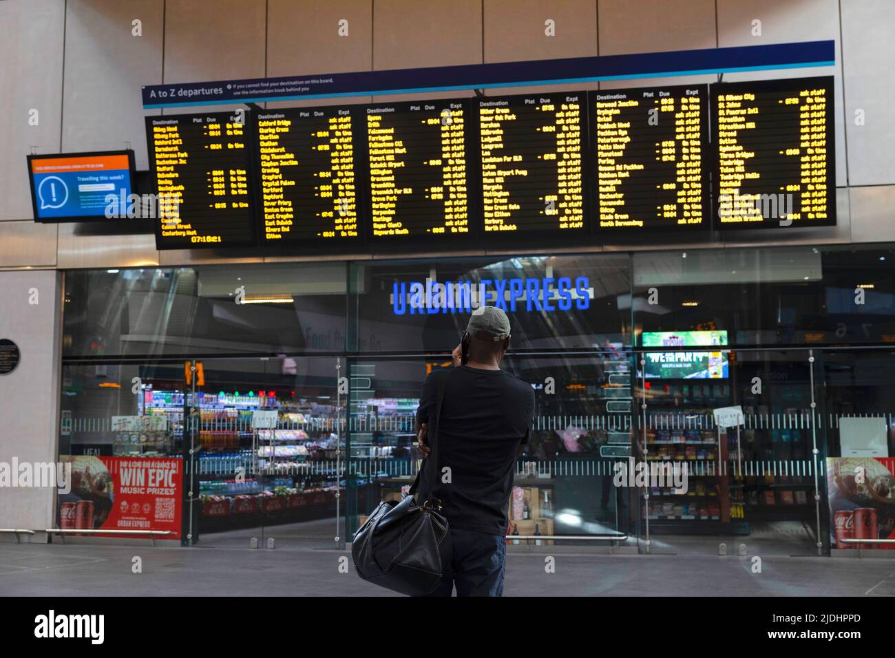 London, UK. 21st June, 2022. A commuter seen checking his commute ...
