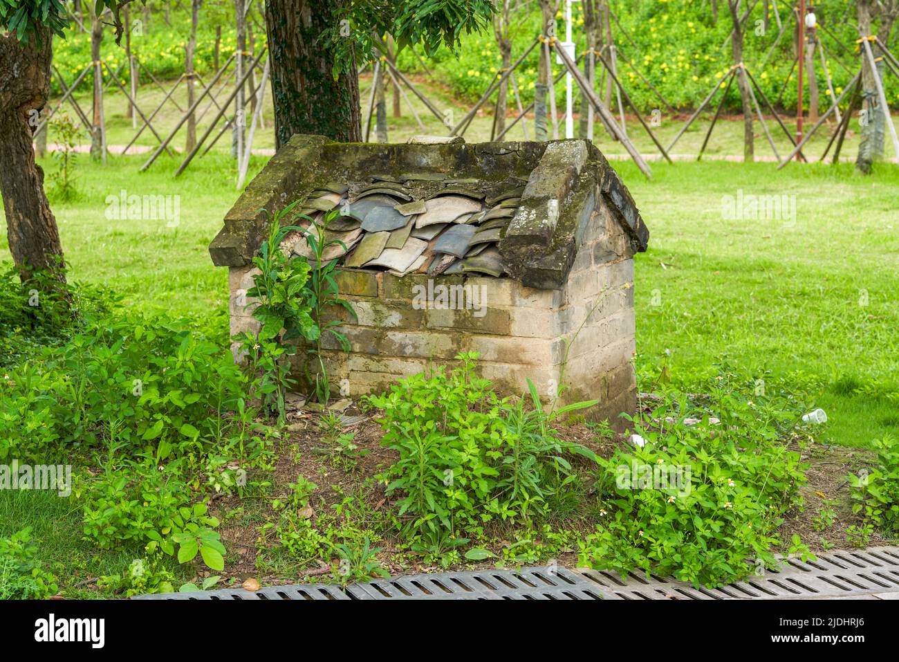 A small river land temple built by villagers by the river Stock Photo ...