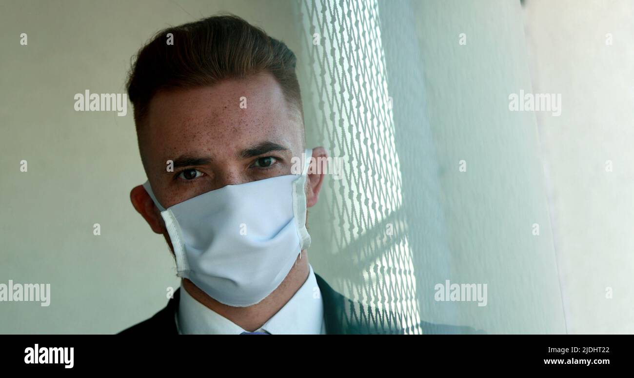 Portrait of man wearing covid-19 face mask prevention against virus ...