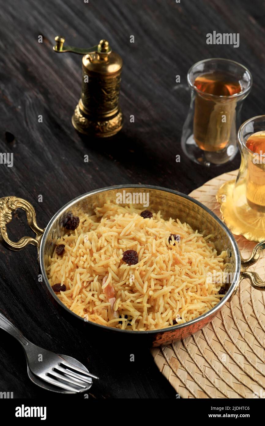 Biryani Rice Dish with Raisin. Beautiful Indian Rice Dish on Copper Pan ...