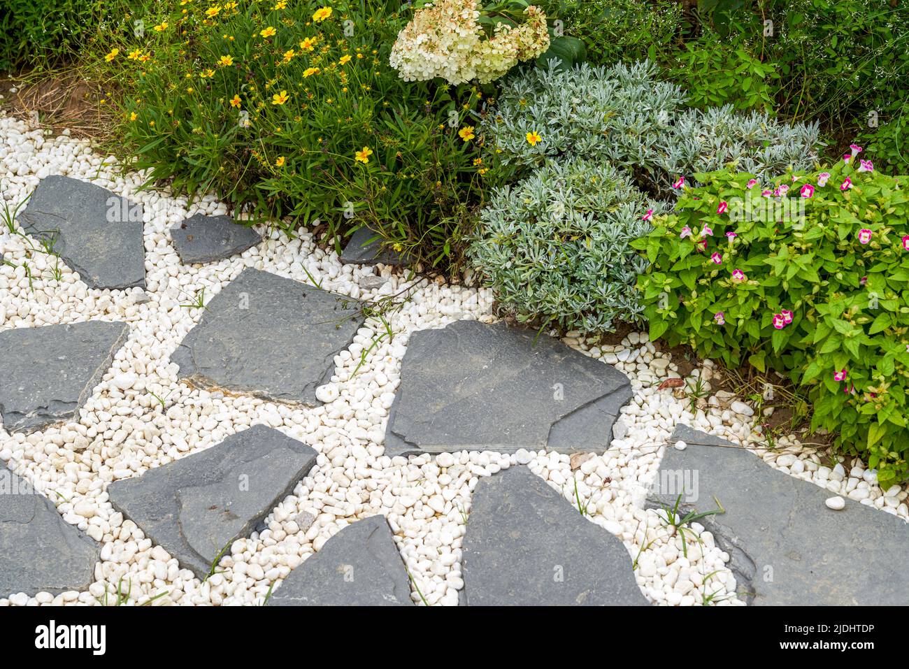 Walking path and zen-like white pagoda gravel landscape in Japanese ...