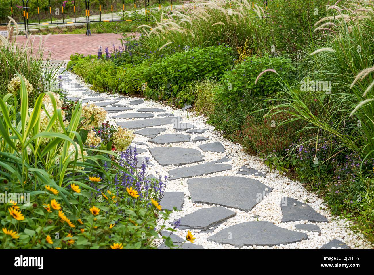 Walking path and zen-like white pagoda gravel landscape in Japanese ...