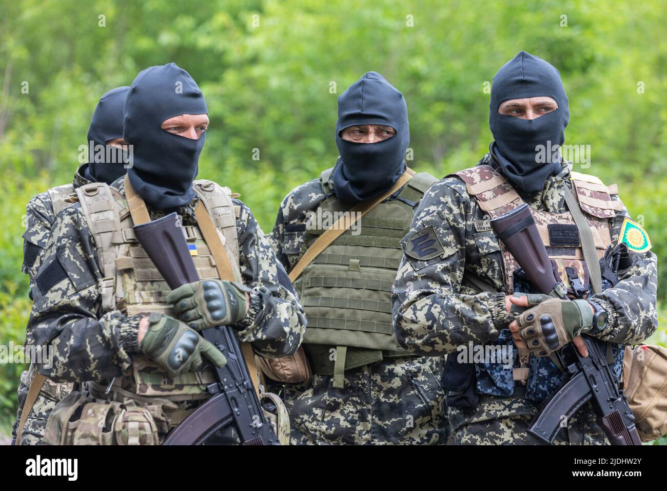 Territorial defense fighters with automatic rifles are in a combat ...