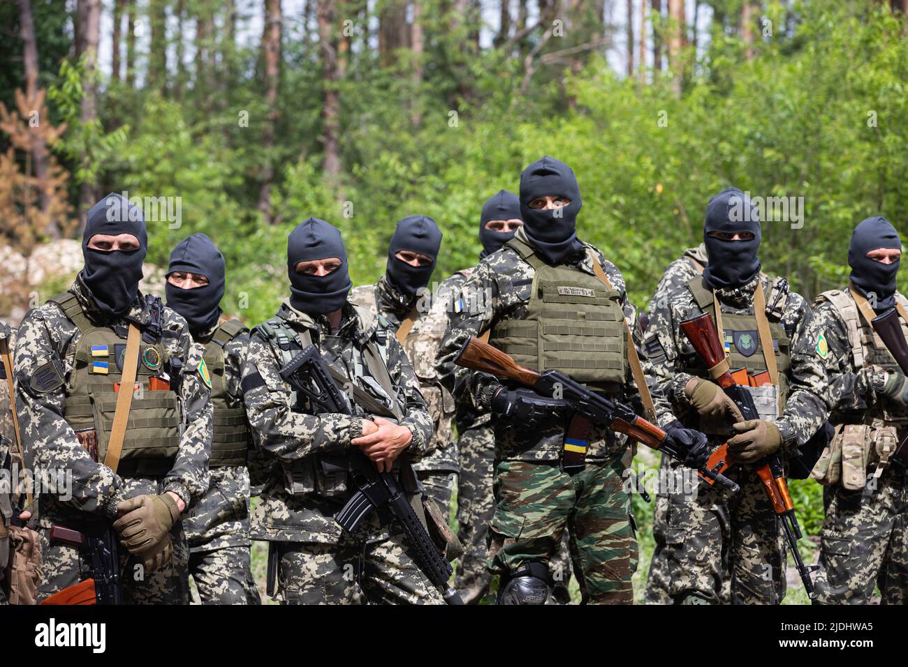 Territorial defense fighters with automatic rifles are in a combat ...