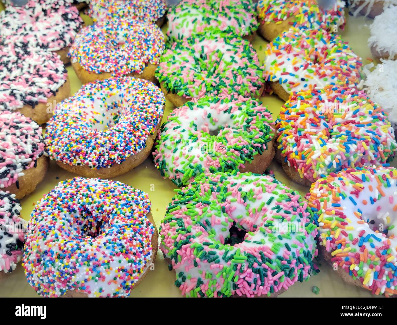 Variety of bakery donuts with colorful sprinkles Stock Photo - Alamy