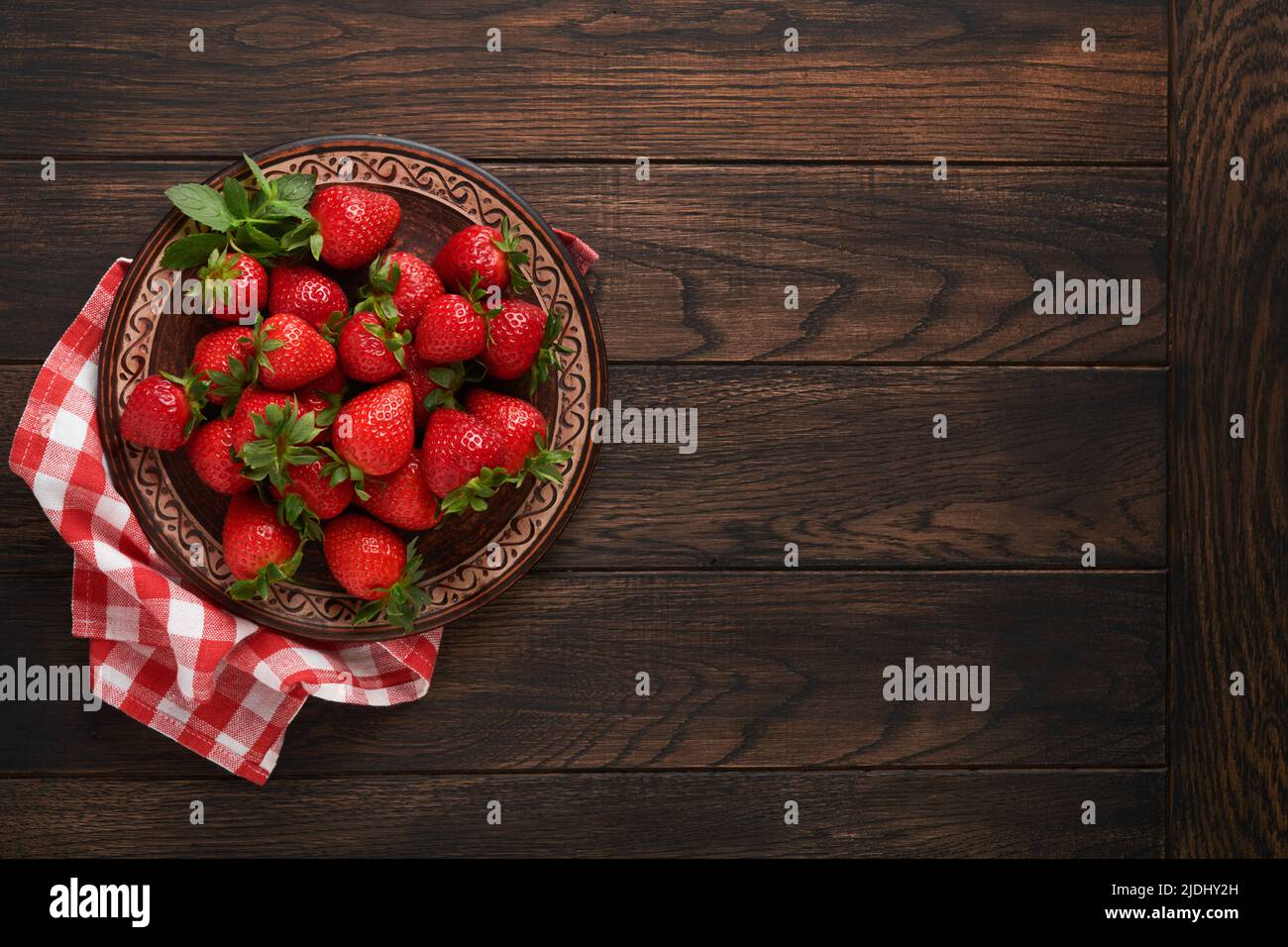 Strawberry berry. Fresh red strawberry in ceramic rustic plate in ...