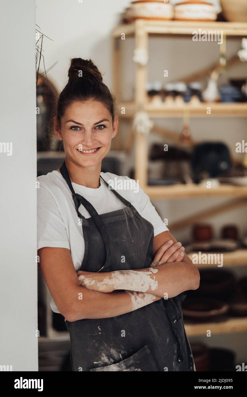 Beautiful Female Entrepreneur in Her Clay Studio, Woman Happy Owner of ... Beautiful Female Entrepreneur in Her Clay Studio, Woman Happy Owner of ...