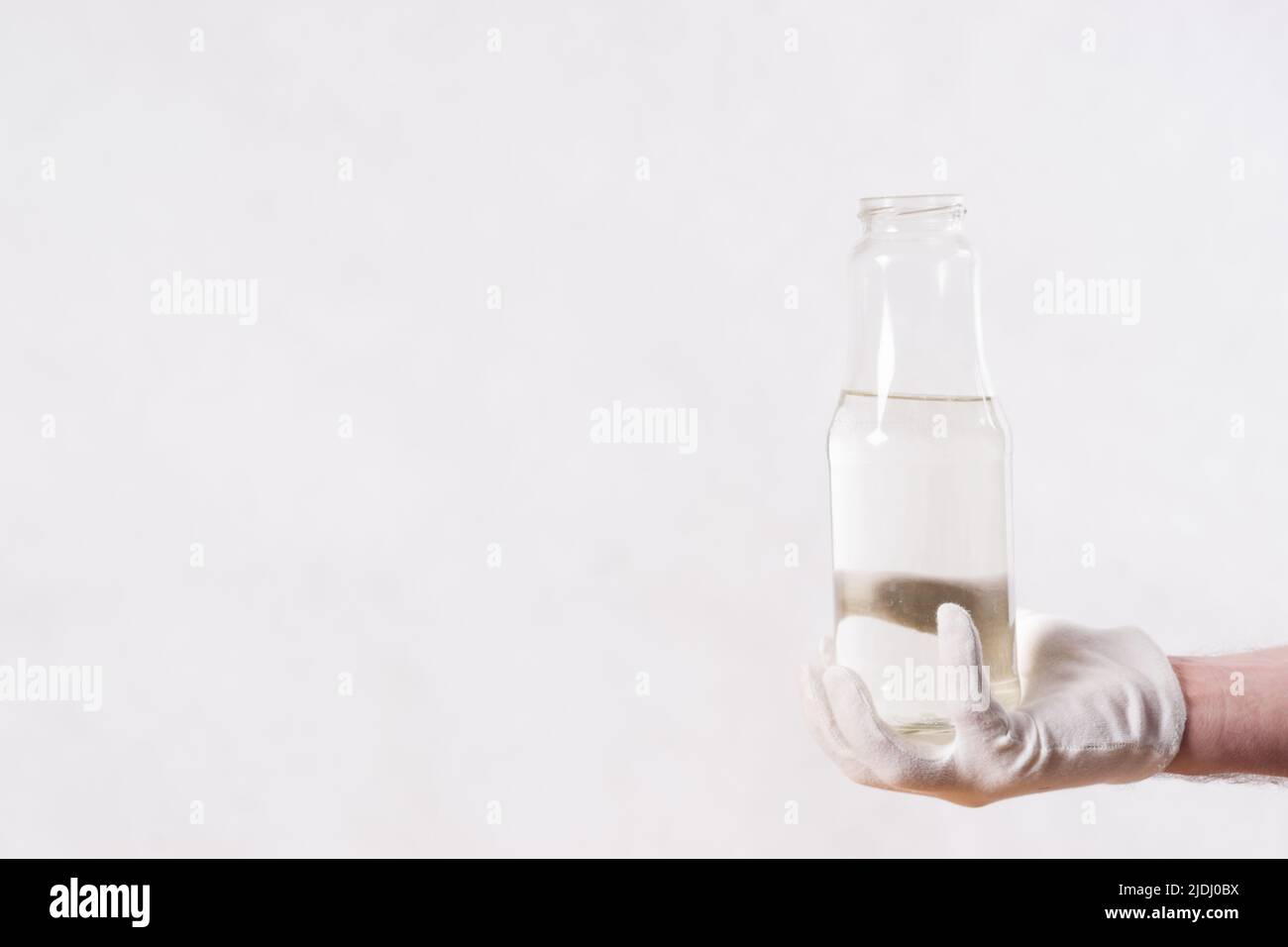 hand with bottle of water Stock Photo - Alamy