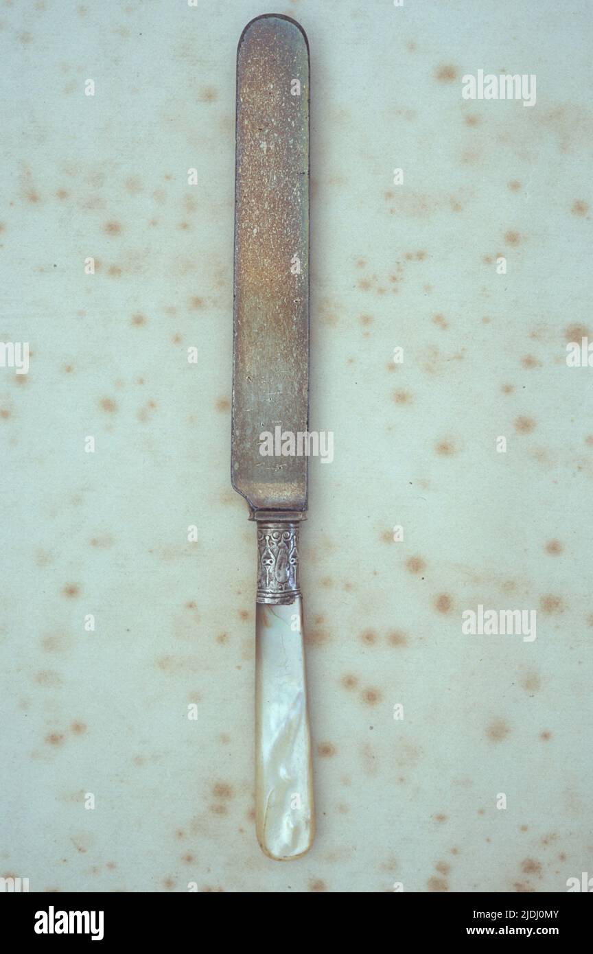 Antique tarnished silver table knife with mother-of-pearl handle and ...