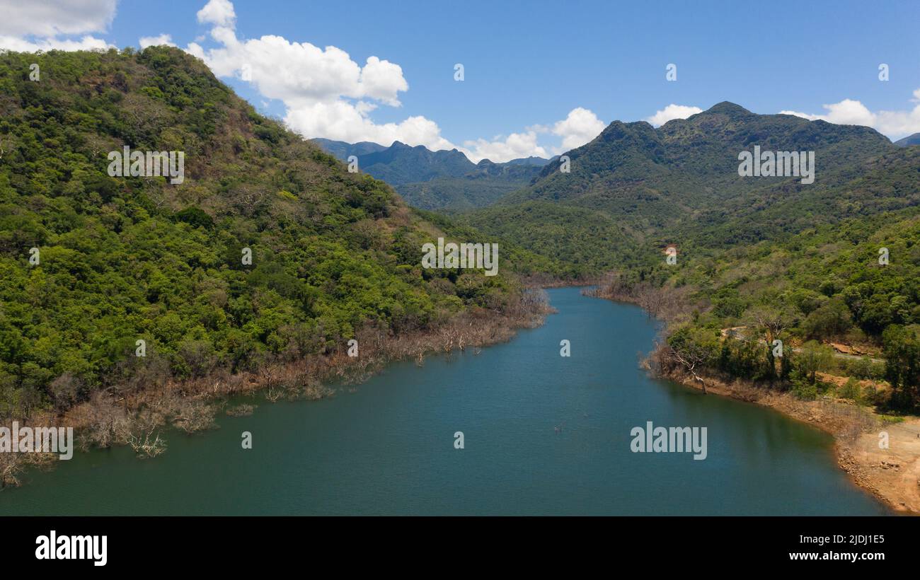 Lake among the mountains covered with green forest and jungle. Kalu ...