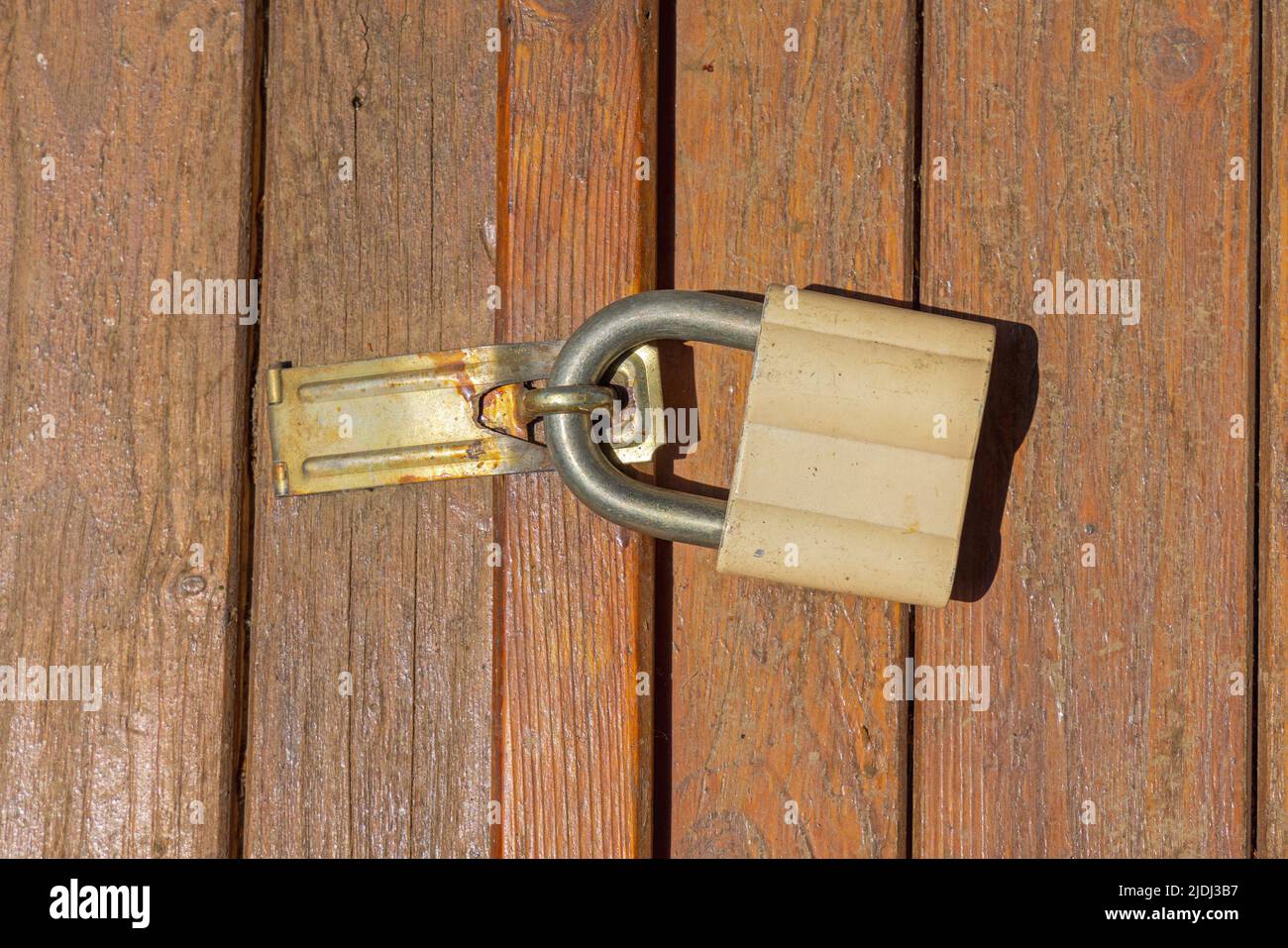 Big Padlock Security at Wooden Door Shed Stock Photo - Alamy