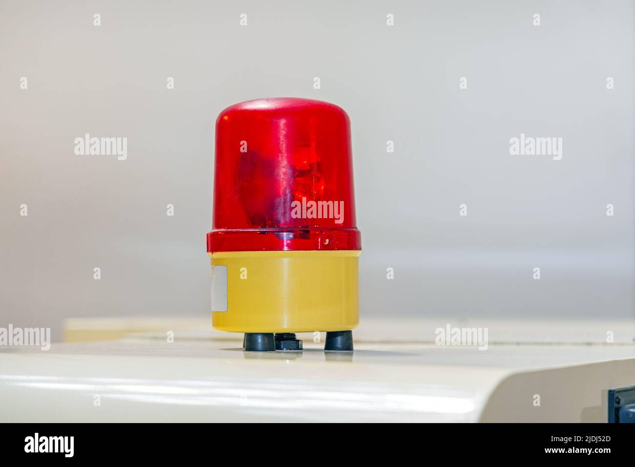 Red Dome Warning Rotating Light at Top of Machine Stock Photo - Alamy