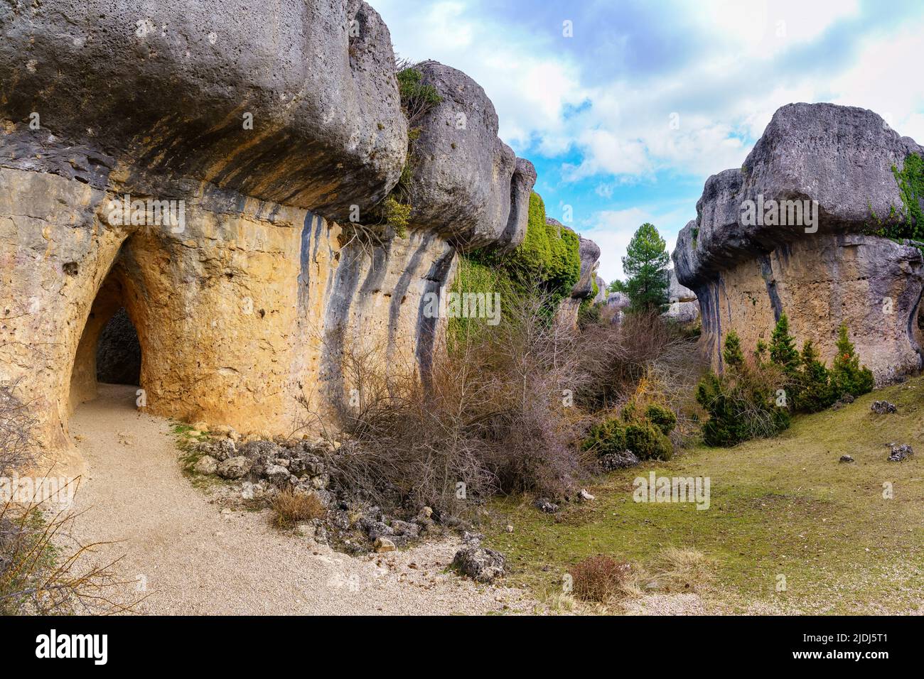 Large weathered rocks with tunnel formed in the huge weathered stone ...