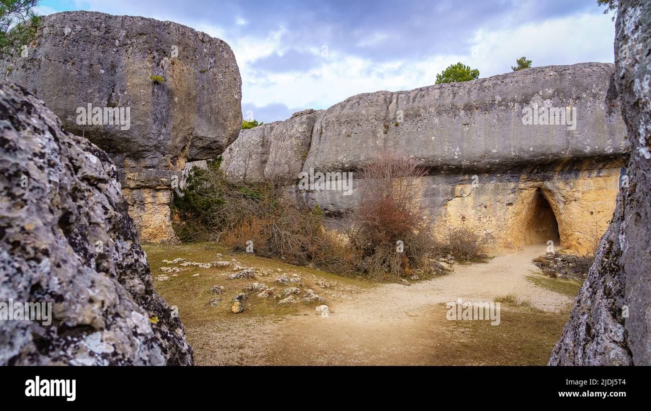 Large weathered rocks with tunnel formed in the huge weathered stone ...