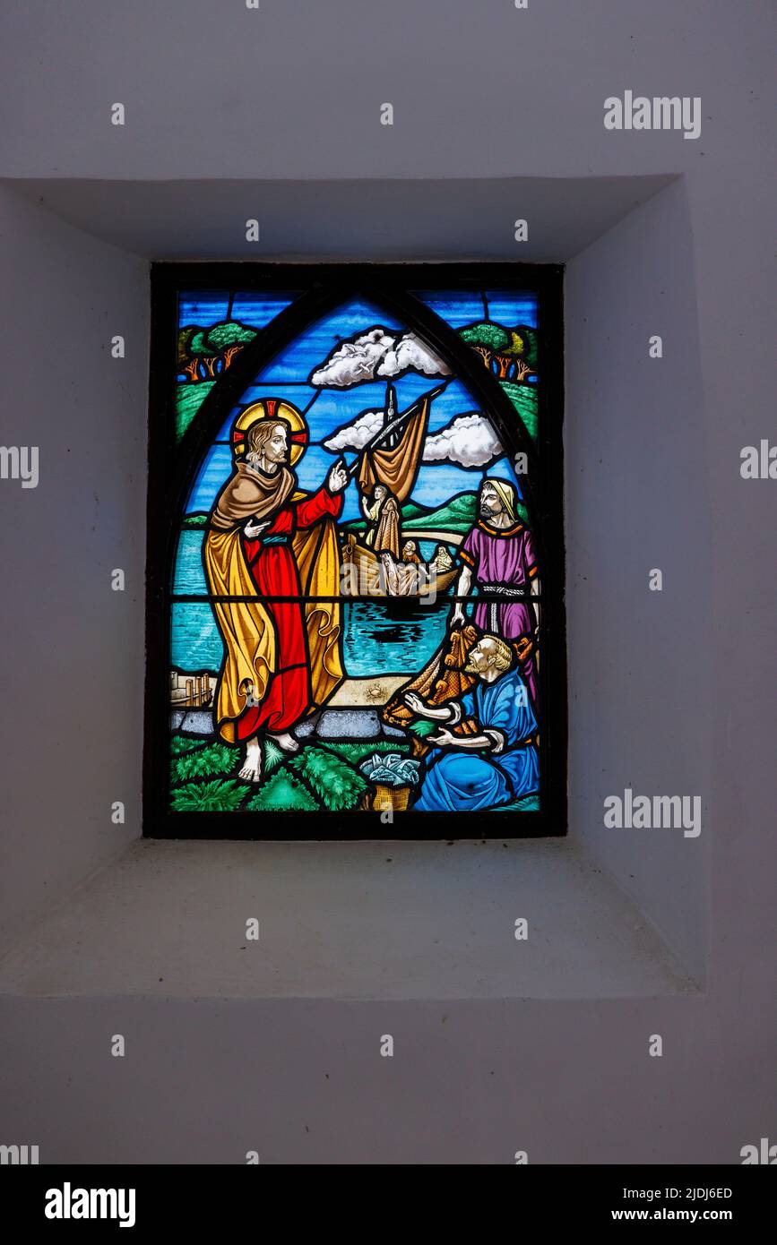 Stained glass window in St Tugual's Chapel in Herm, an island in the Bailiwick of Guernsey ...