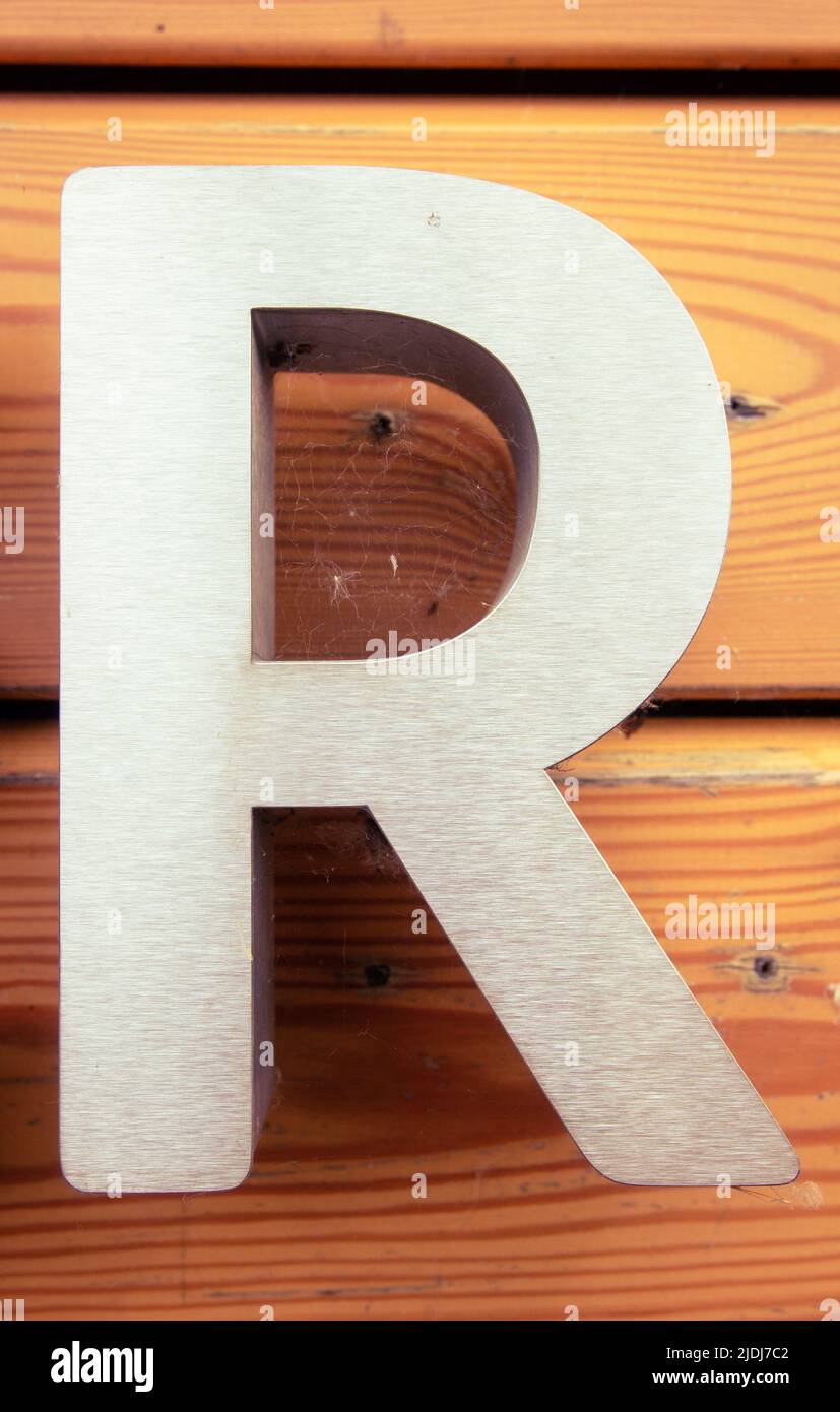 A capital letter R on the front of a public building Stock Photo - Alamy