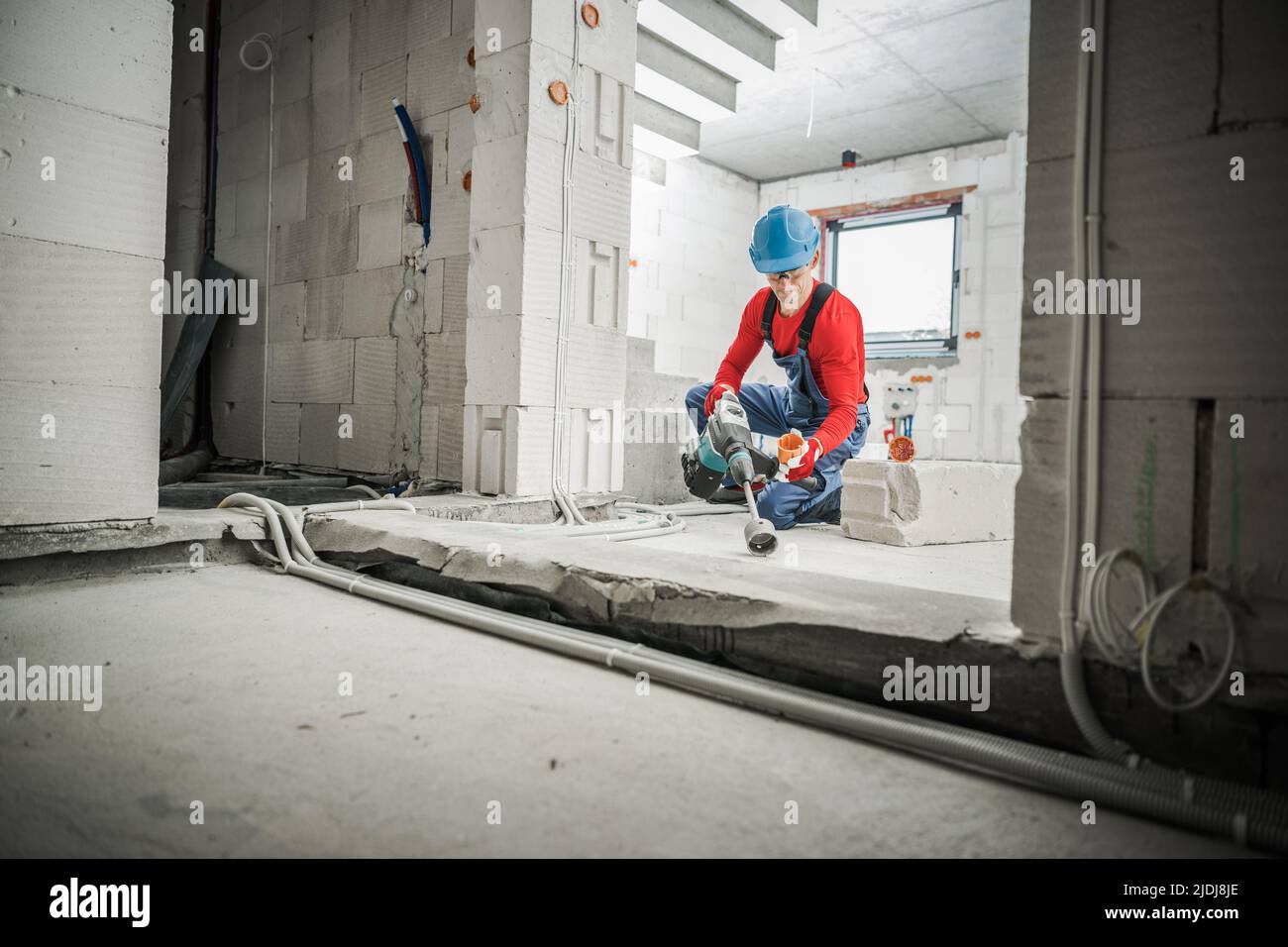 Caucasian Construction Worker in Safety Helmet and Glasses Doing His ...