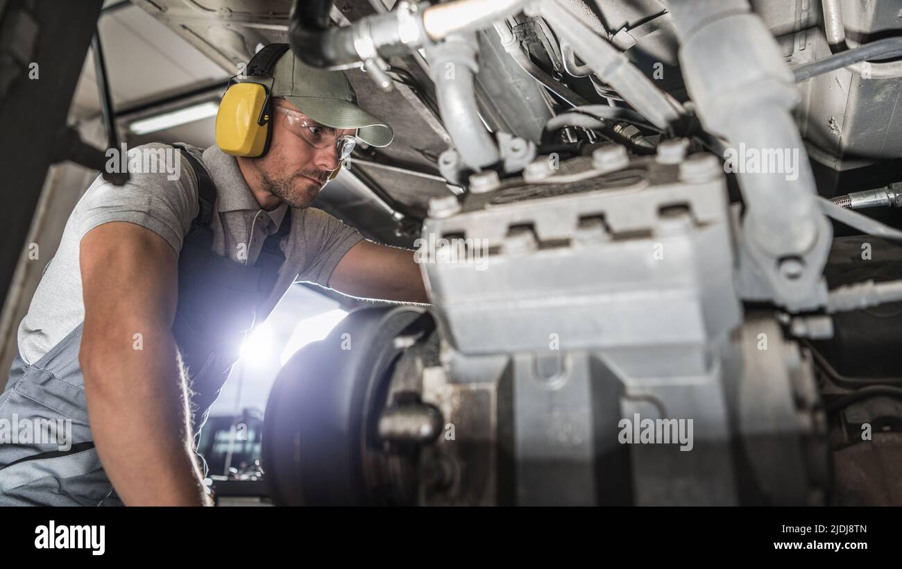 Caucasian Industry Mechanic in His 40s Performing Diesel Pusher ...