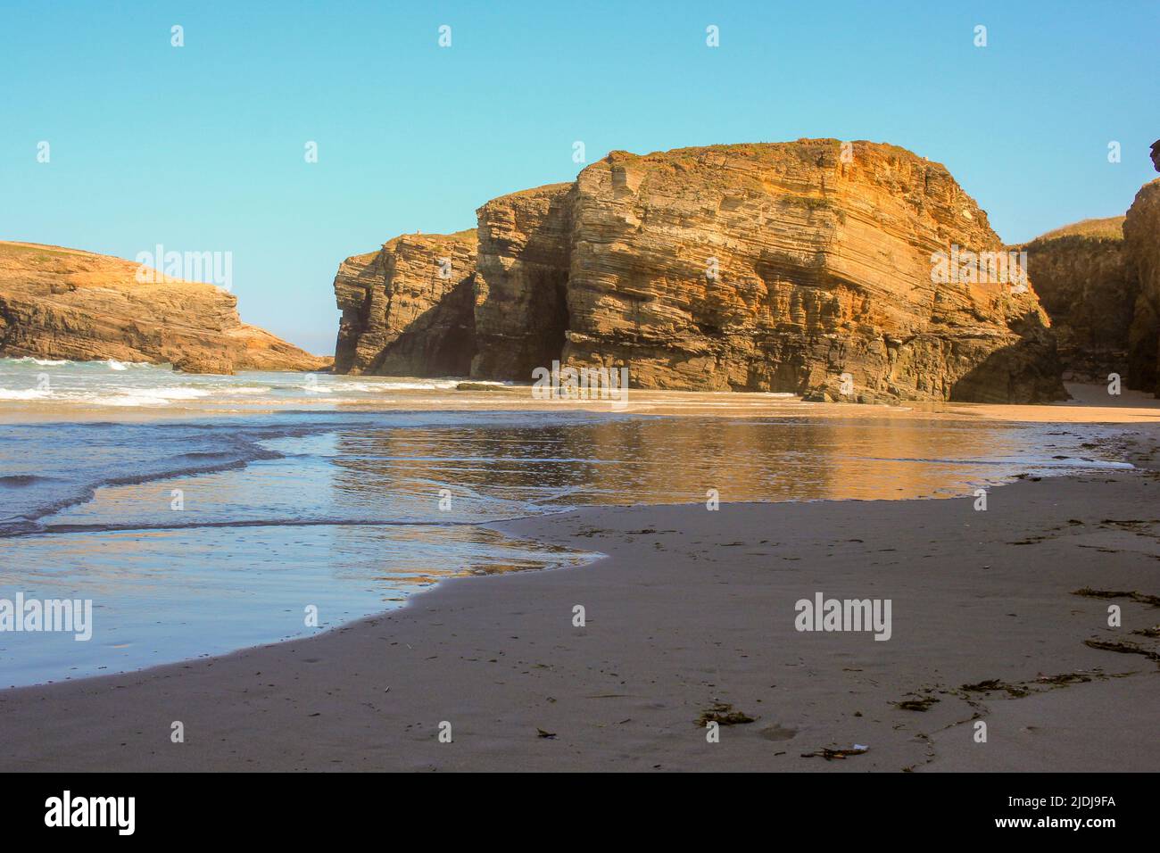 a day on the beach among the rocks and cold water Stock Photo - Alamy