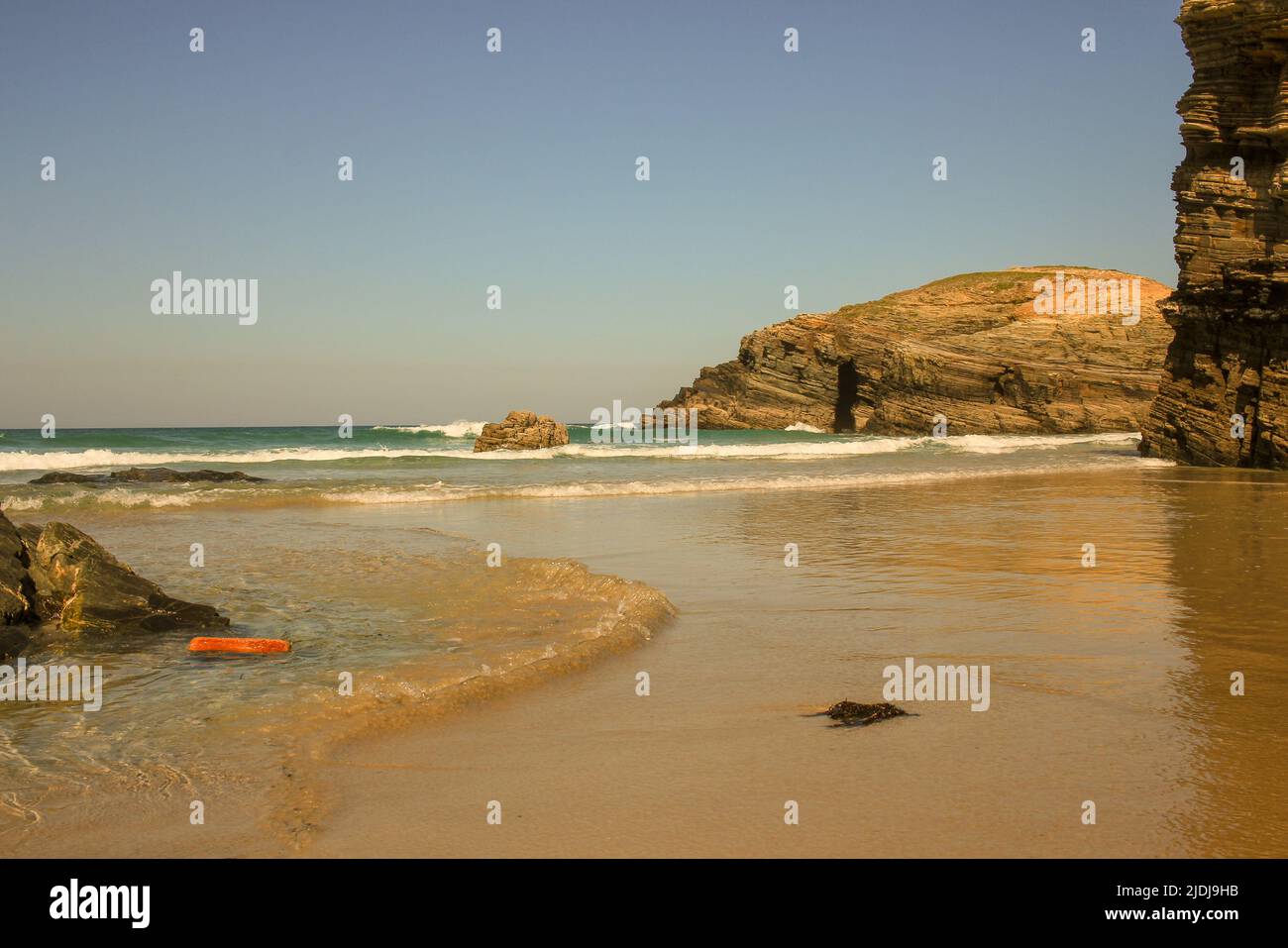 a day on the beach among the rocks and cold water Stock Photo - Alamy